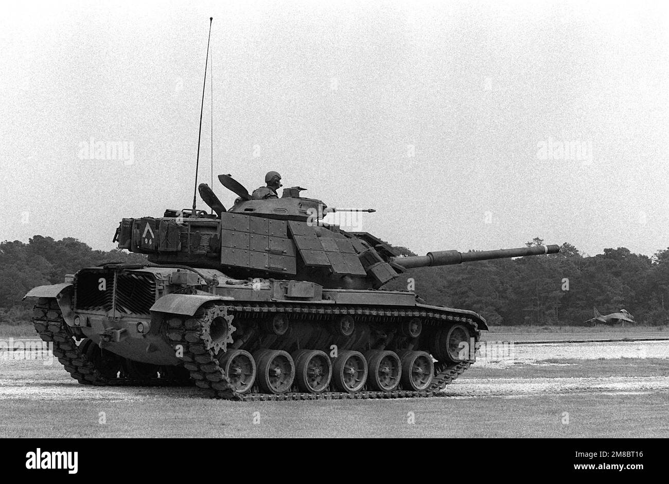 A Marine looks out from the commander's cupola of an M-60A1 main battle ...