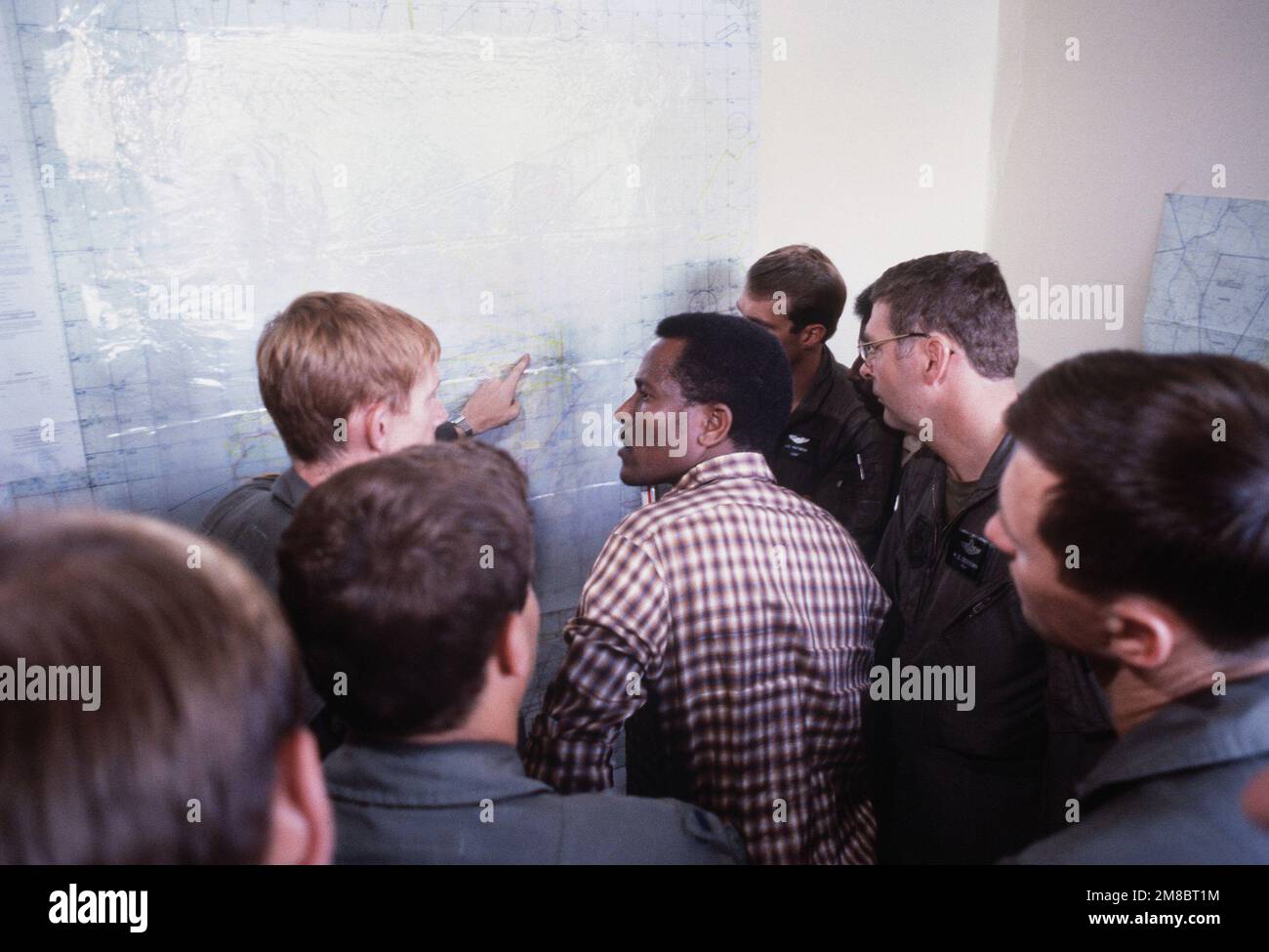 Members of the 67th Special Operations Squadron consult with members of ...