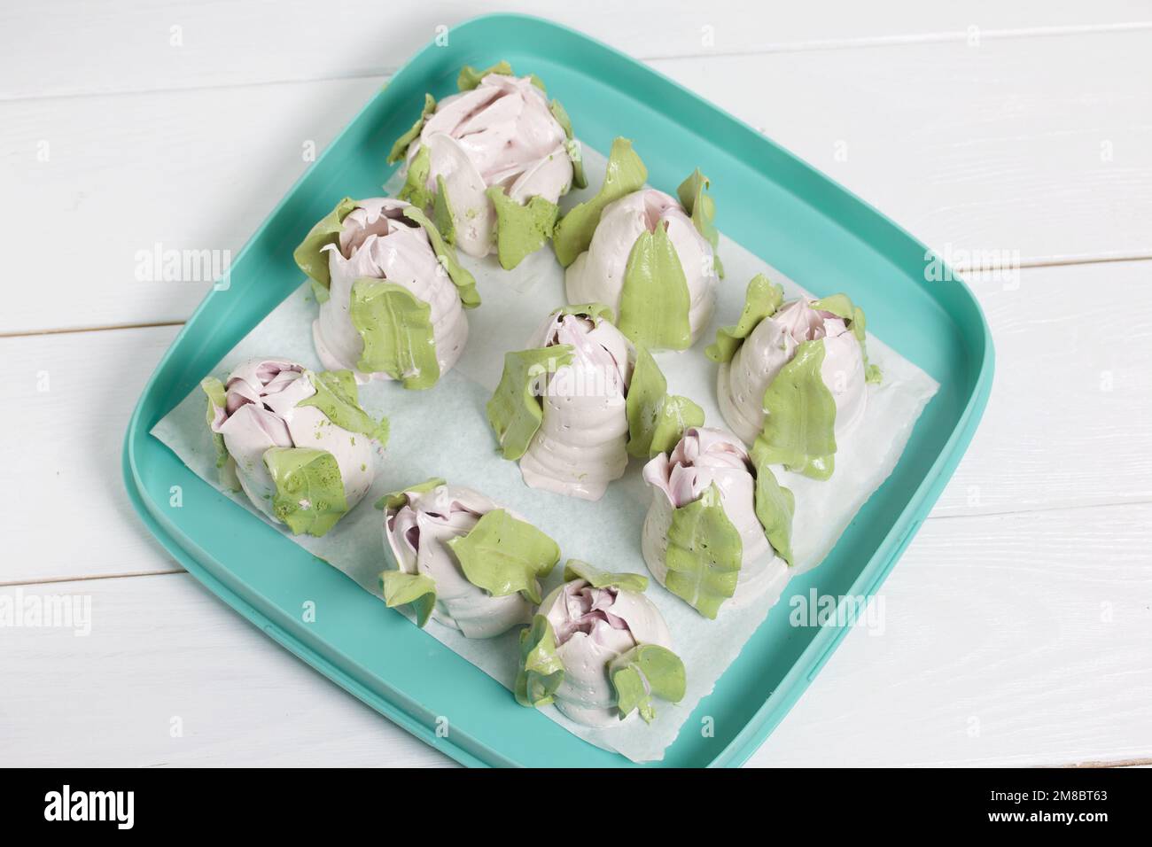 Homemade zephyr tulips dry on a tray. On a white background Stock Photo ...