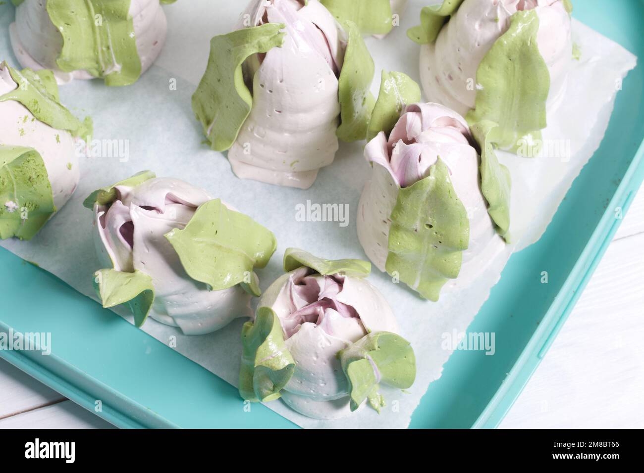 Homemade zephyr tulips dry on a tray. On a white background Stock Photo ...