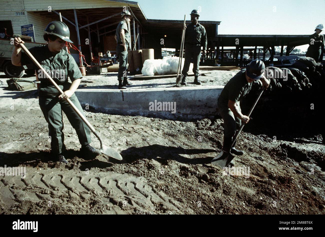 Seabees of Construction Battalion Unit 402 (CBU 402) prepare ground for ...