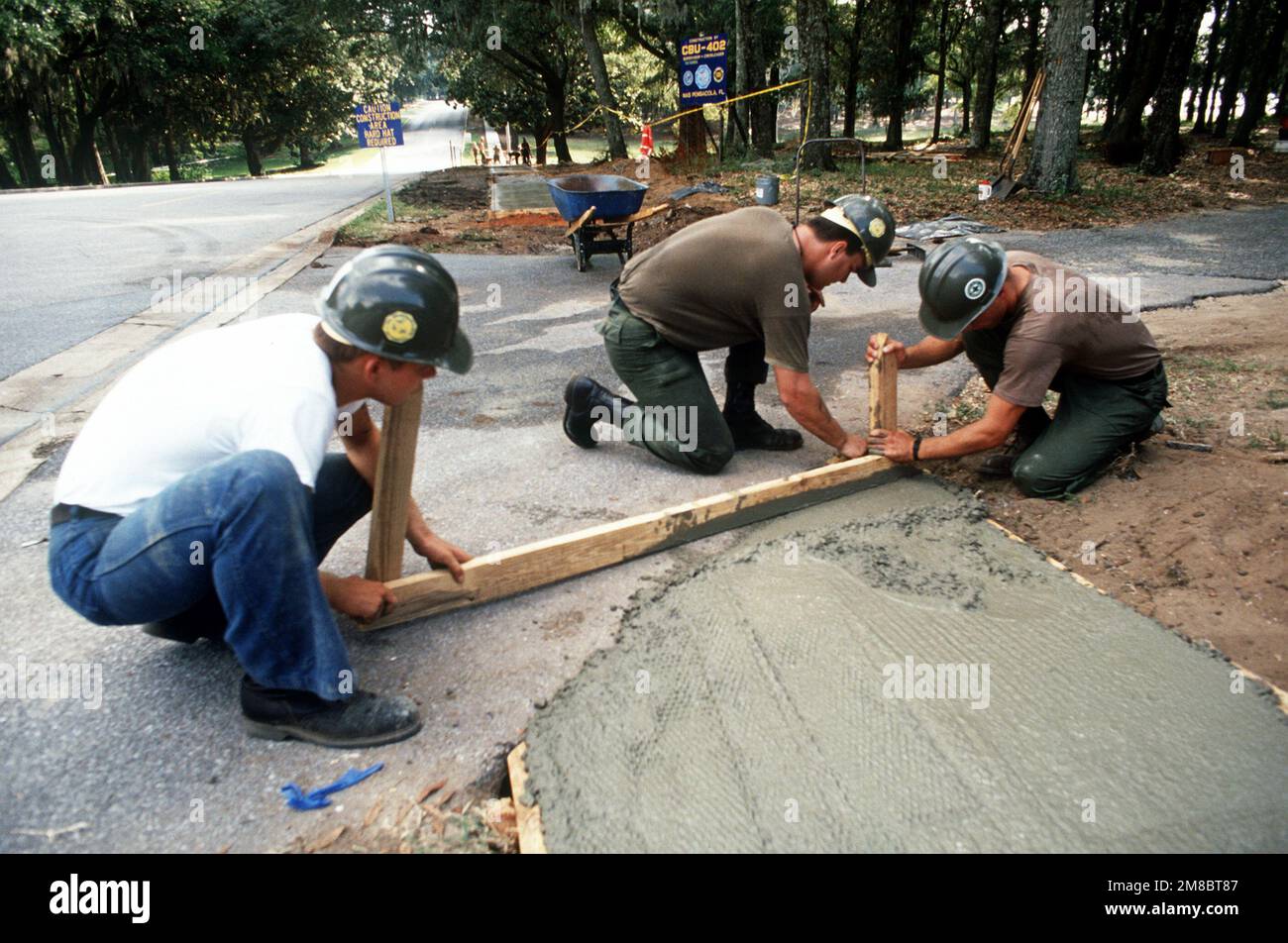 Seabees of Construction Battalion Unit 402 (CBU 402) position a strike ...