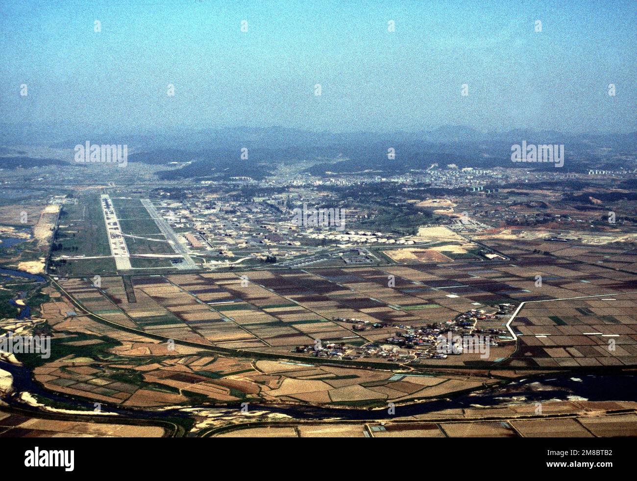 An aerial view of the base and surroundings. Base: Osan Air Base ...