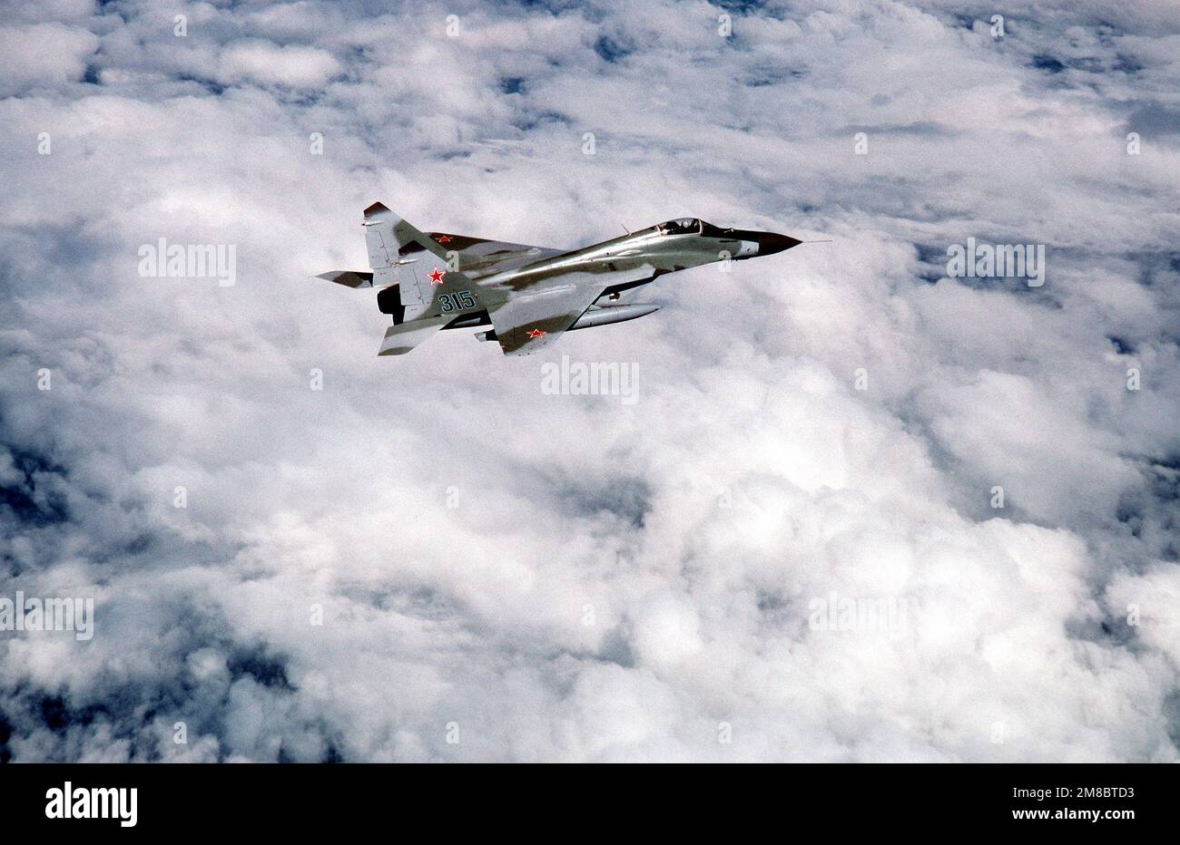 An air-to-air right side view of a Soviet MiG-29 aircraft en route to ...