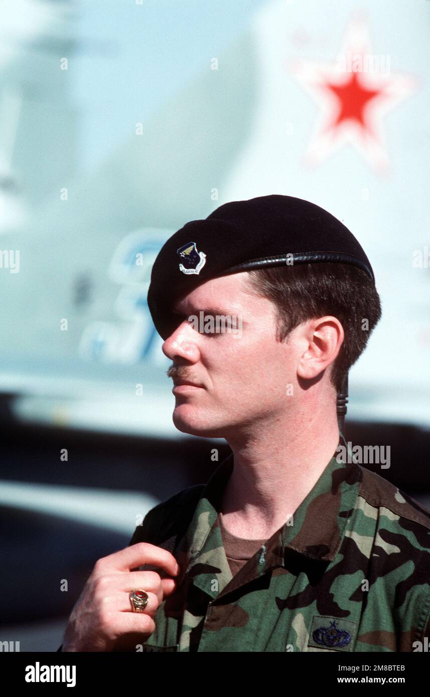 SSGT Mark W. Ingram of the 21st Security Police is framed by the tail ...