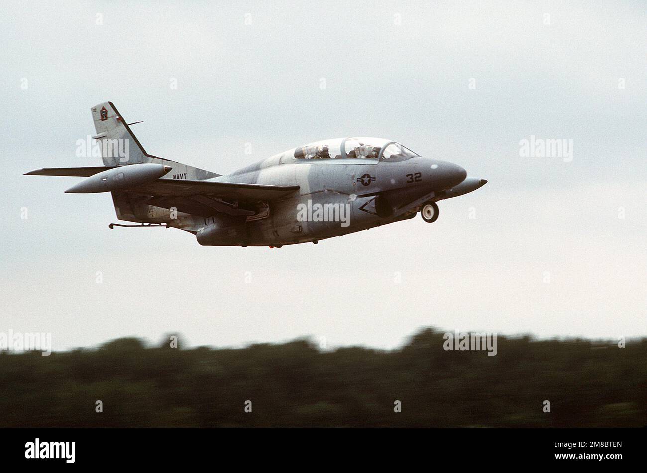 A T-2C Buckeye aircraft from Fighter Squadron 43 (VF-43) clears the end ...