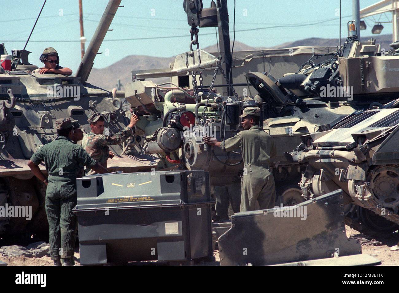 Soldiers from the 24th Infantry Division (Mechanized) watch the ...
