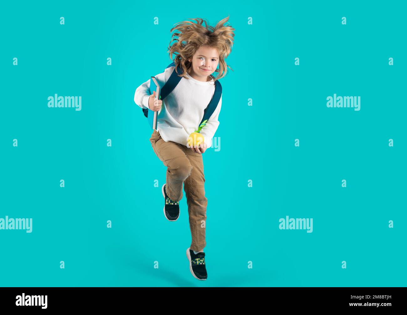 Back to school. Funny excited school concept. Little student boy with ...
