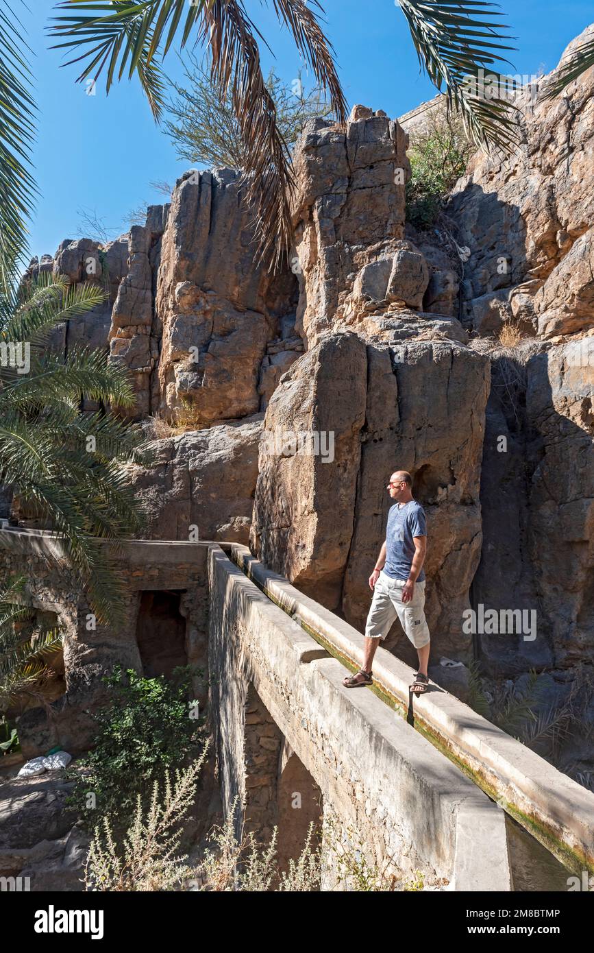 Tourist visits Falaj irrigation system at Misfah al Abriyyin, Oman ...