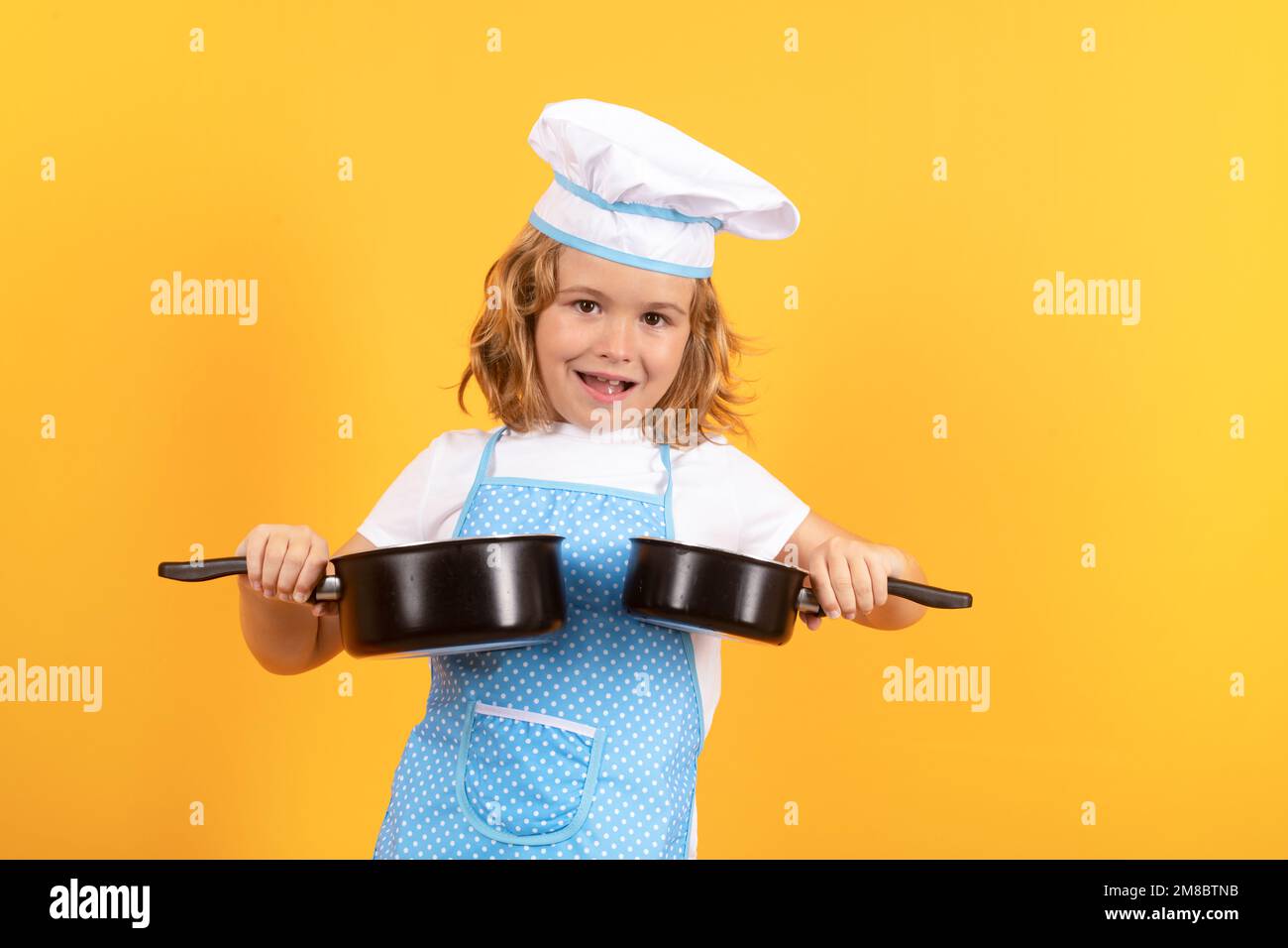 Kid chef cook with cooking pot stockpot. Kid in cooker uniform and chef ...