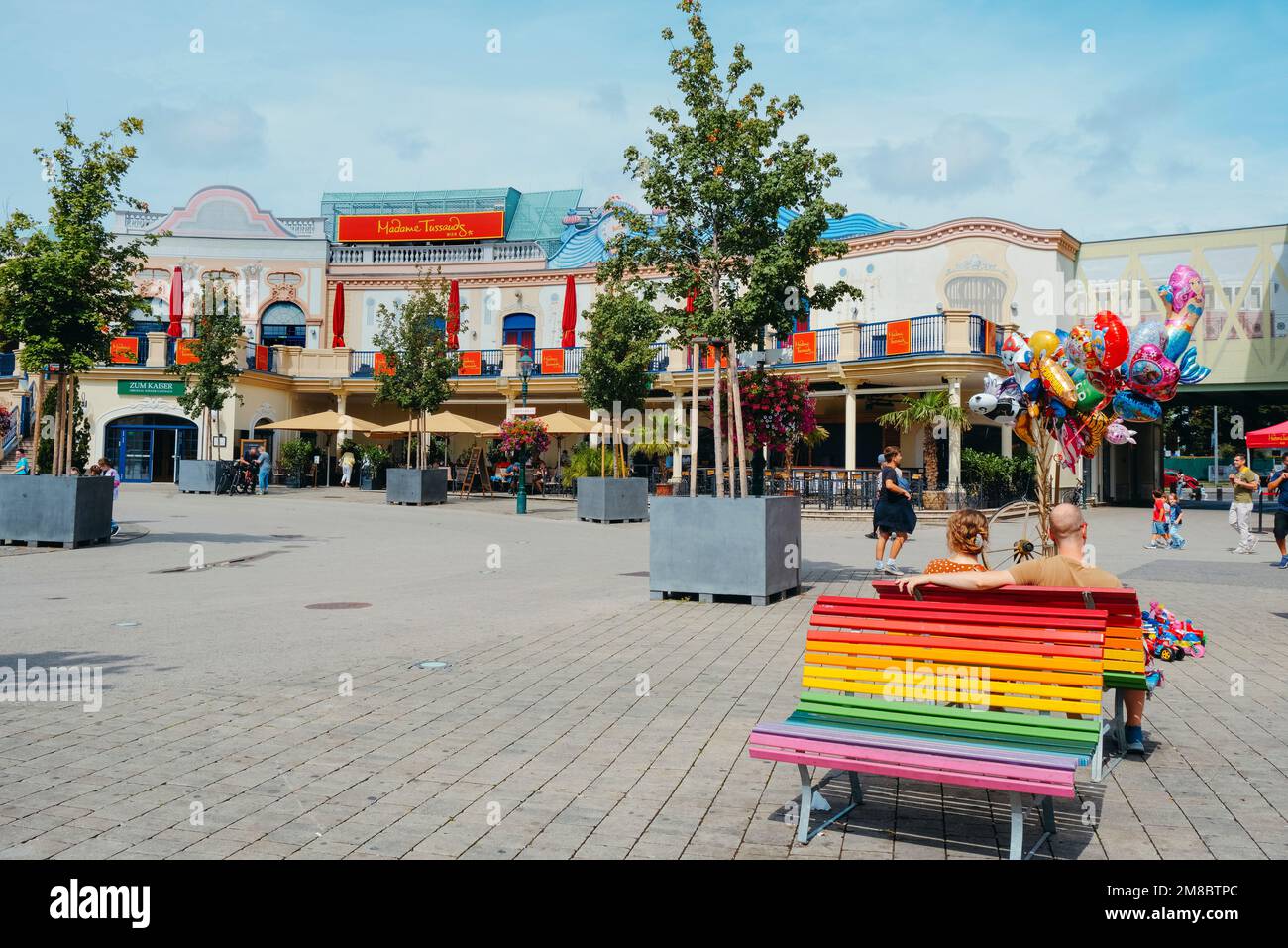Vienna, Austria - August 28, 2022: People rest sitting on a bench ...