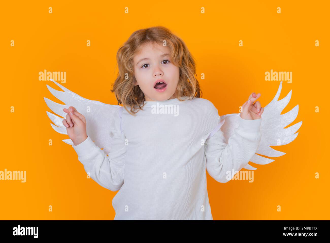 Child angel crossed fingers with lucky and hope, good luck. Beautiful ...