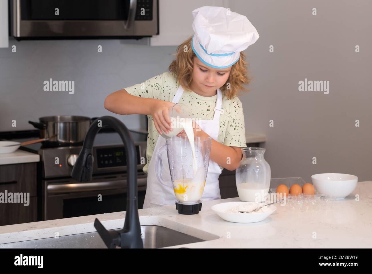 Fun kids kitchen. Funny little kid chef cook wearing uniform cook cap ...
