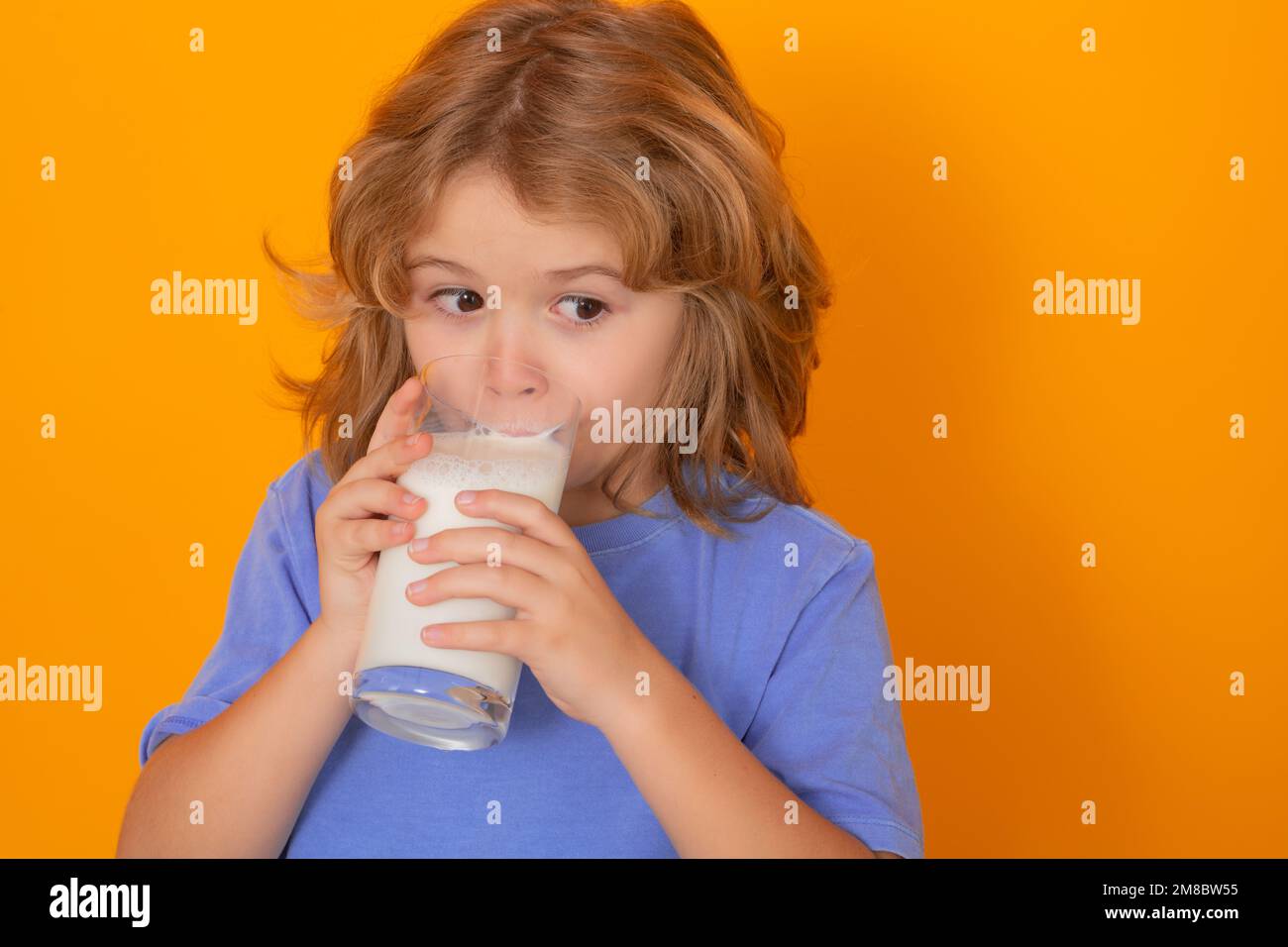 Organic milk. Beautiful smiling child with a glass of milk. Cute boy in ...