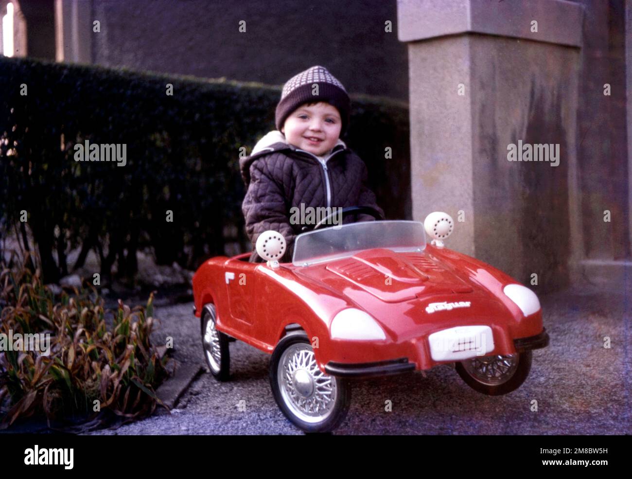 A happy looking young boy in a red car pedal 1967 Photo by Tony Henshaw ...