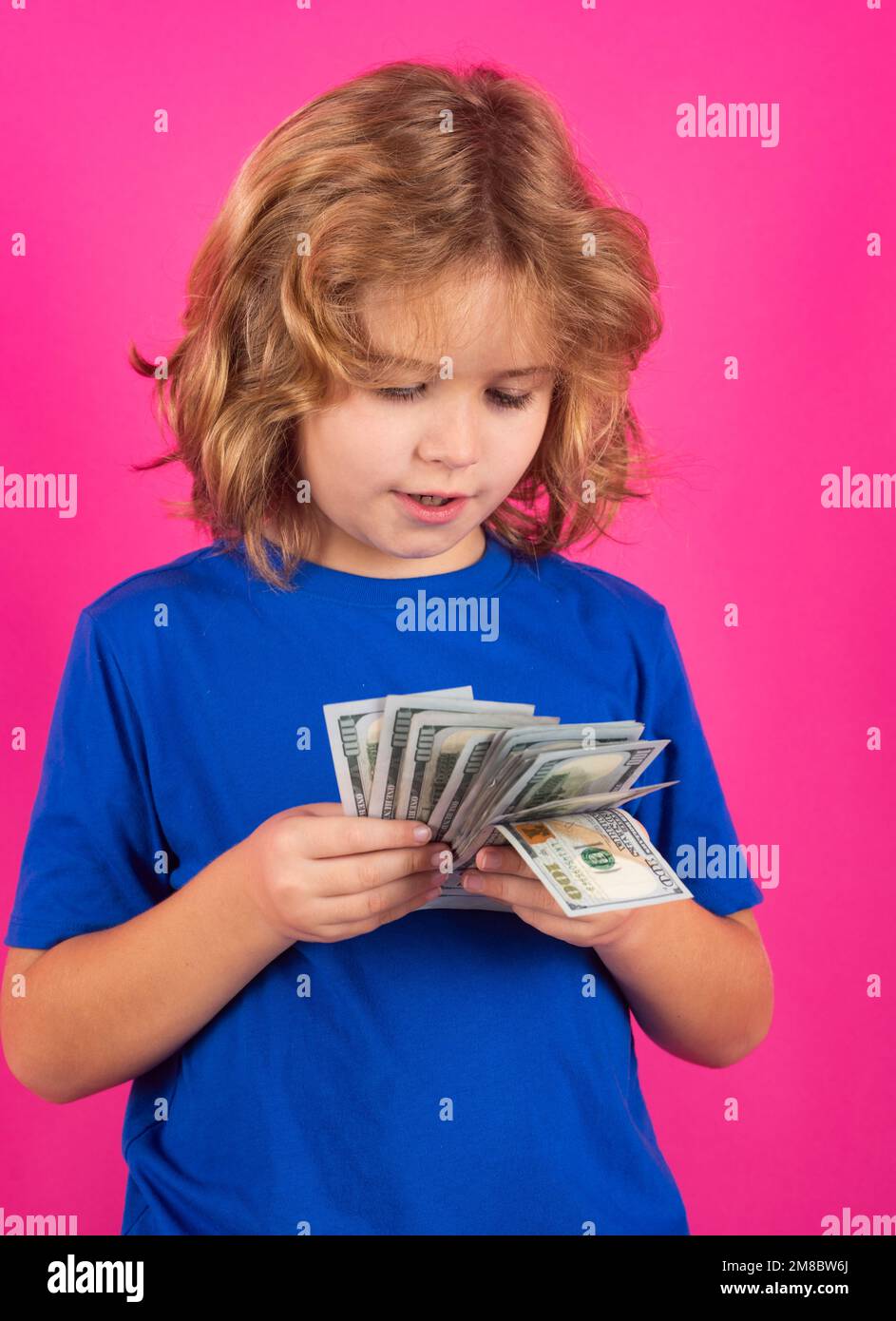 Money bills, salary payment. Studio portrait of child with money ...