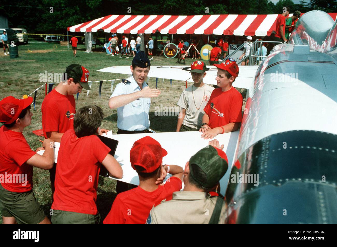 Boy Scouts gather around the stabilizer of a T-38 Talon aircraft as ...