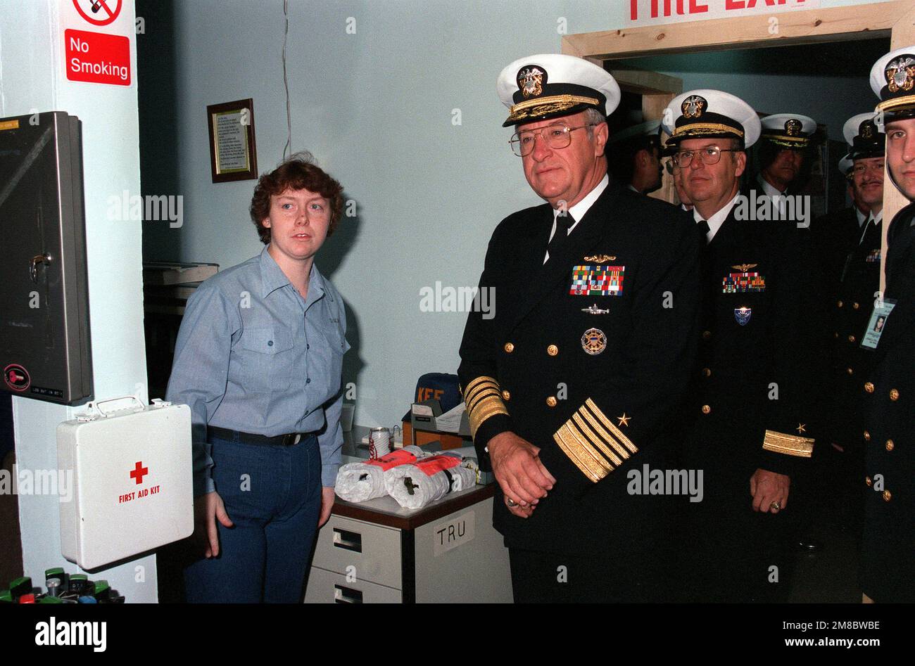 CHIEF of Naval Operations Adm. Carlisle A.H. Trost, center, passes through an office during his ...