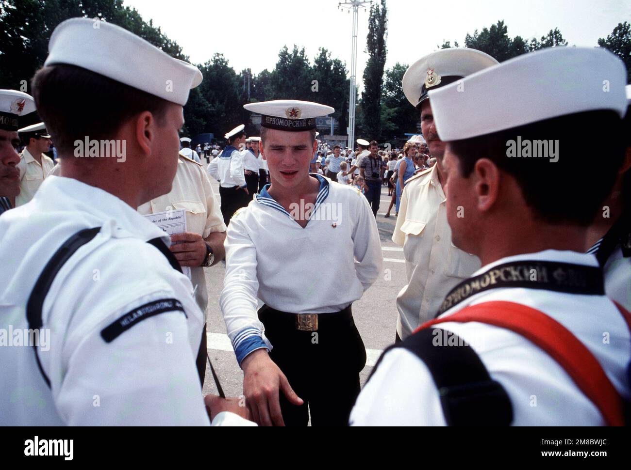 Soviet and American naval personnel converse during the visit of the ...