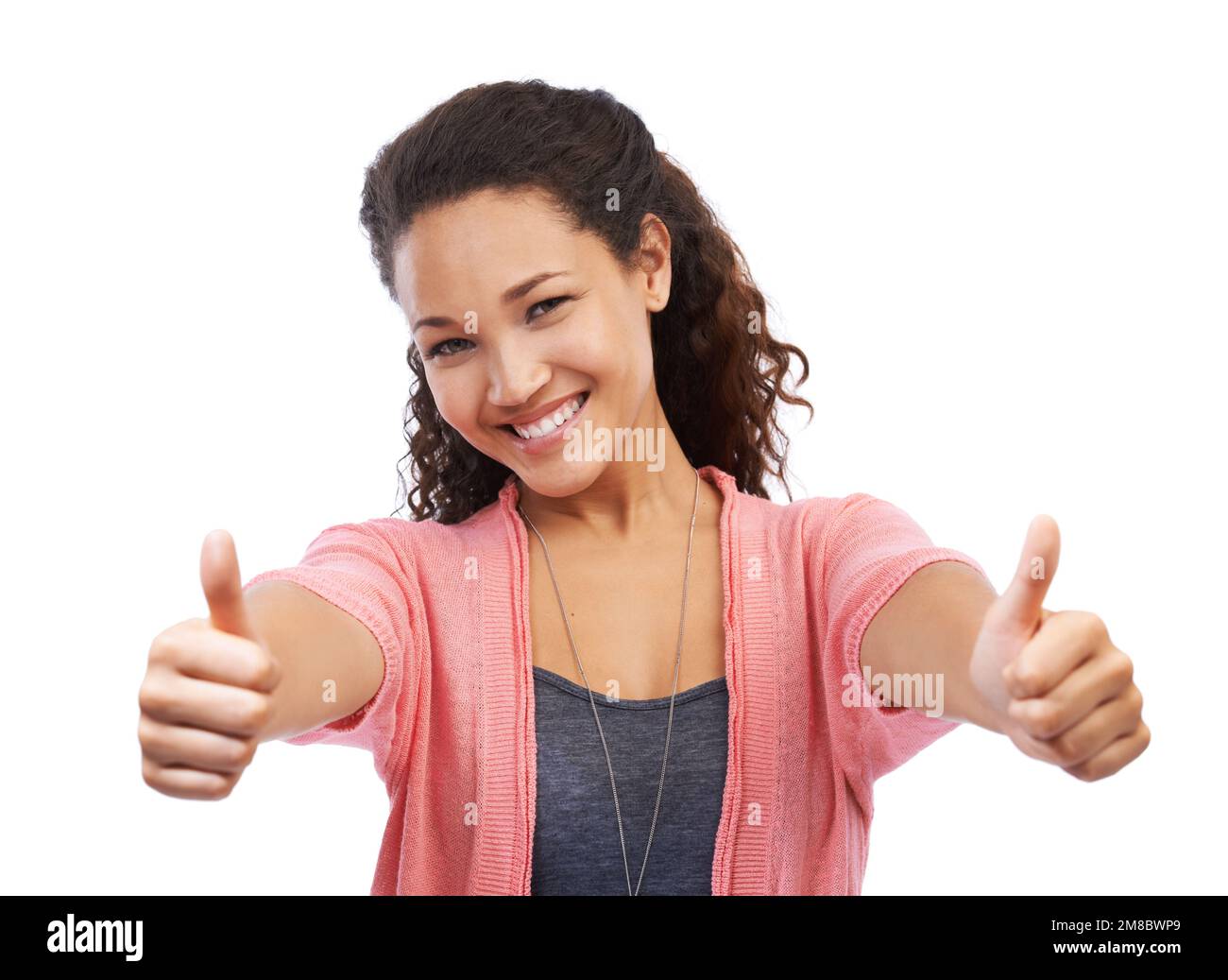 Success, face portrait and thumbs up of woman in studio on a white ...