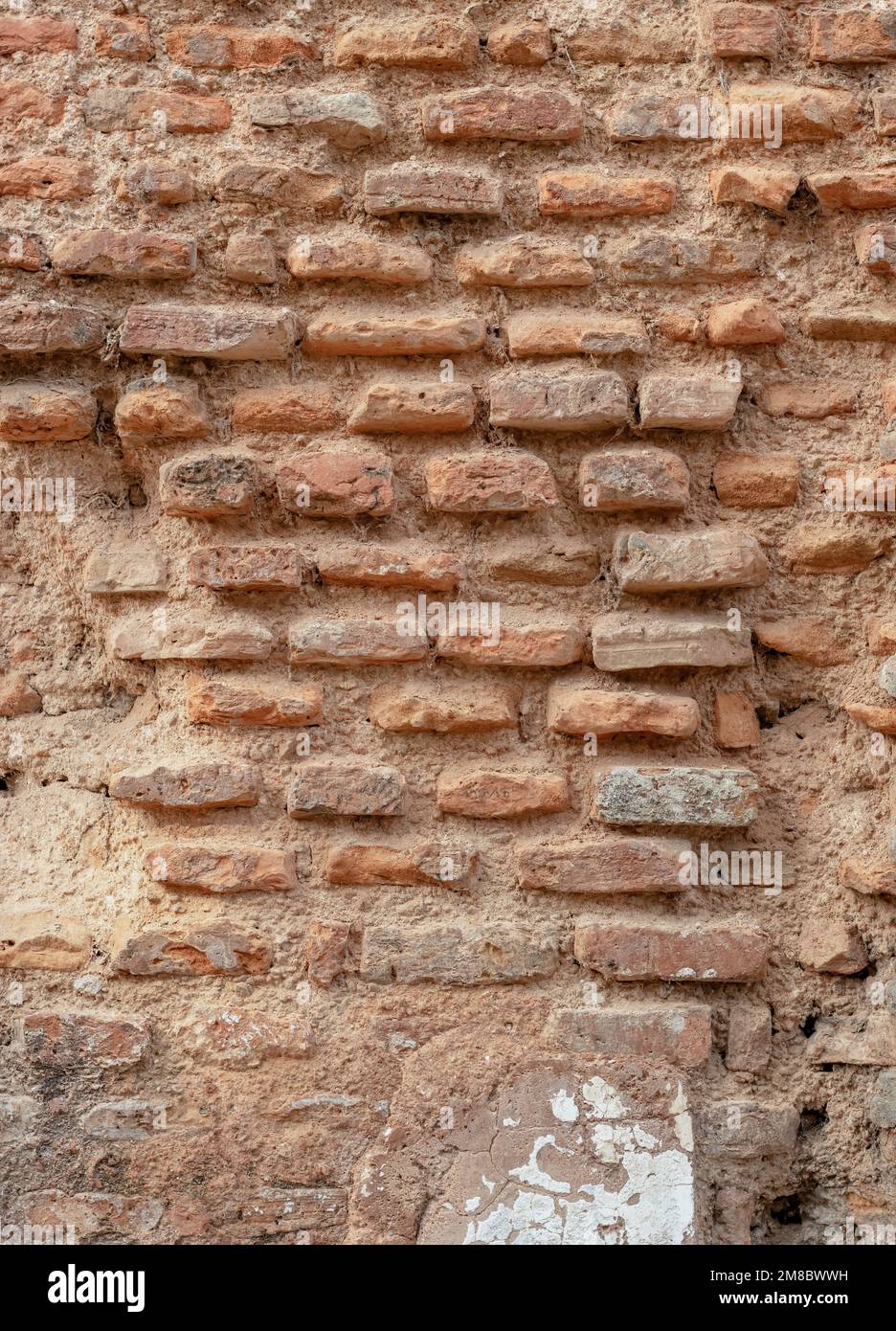 Damaged old brick wall with broken edge Stock Photo - Alamy