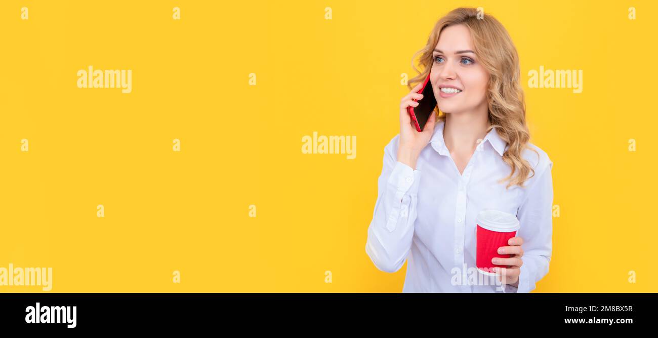blonde woman smile with coffee cup talking on phone on yellow ...