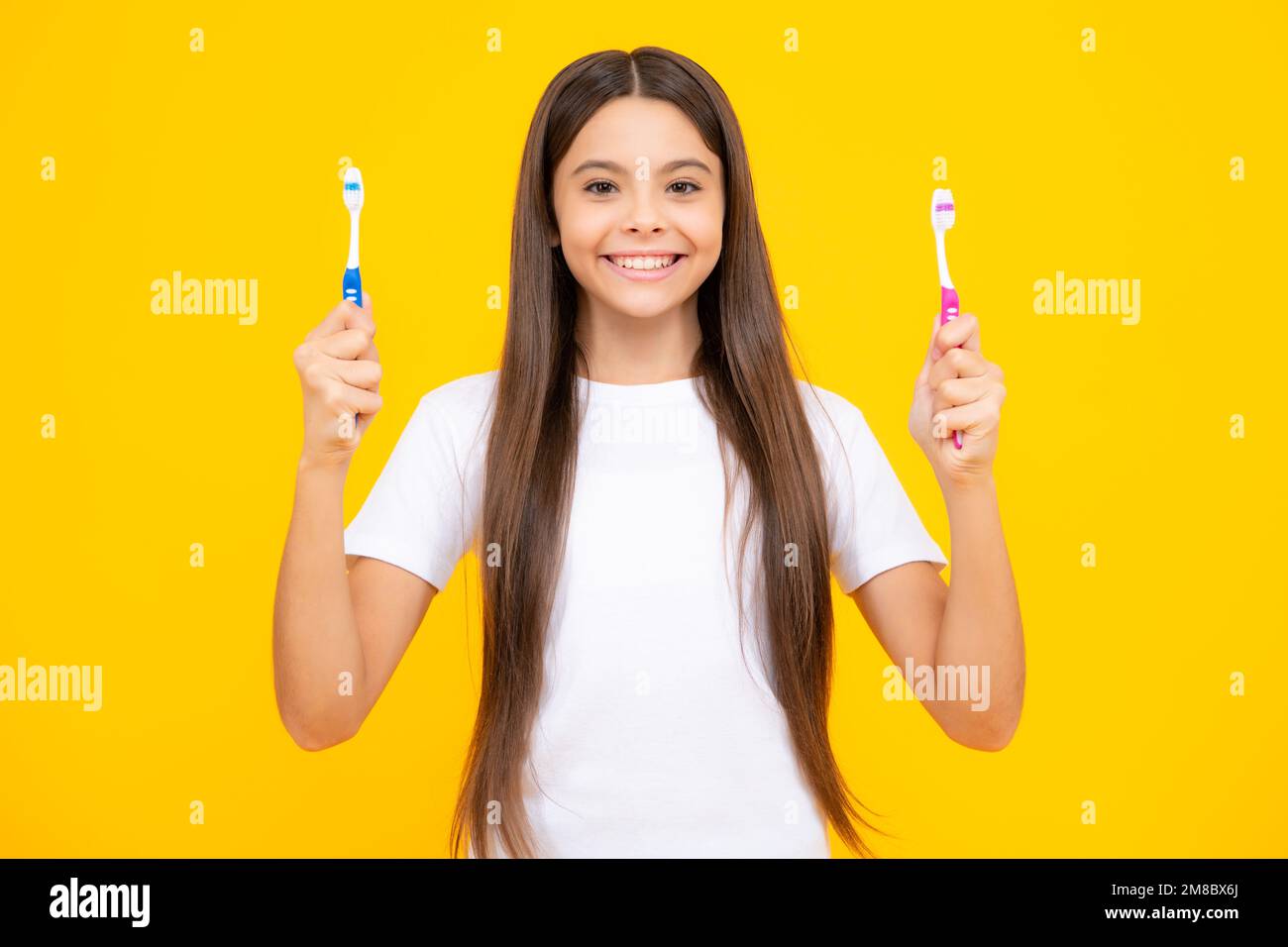 Happy teenager portrait. Girl cleaning teeth. Kid brushing teeth with ...
