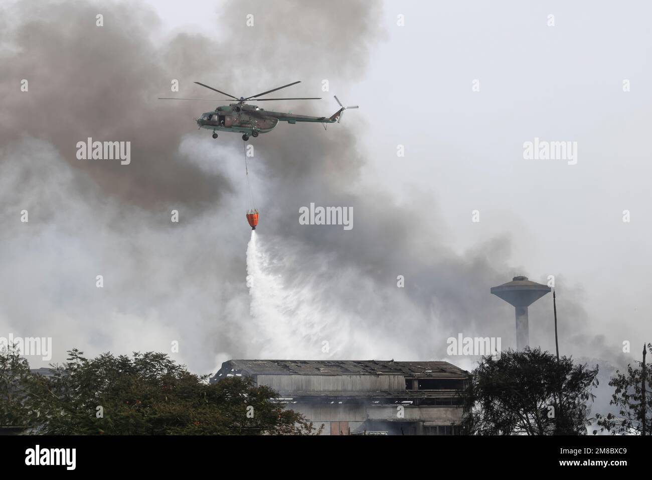 Cuban armed forces helicopter putting out the fire from the explosion ...