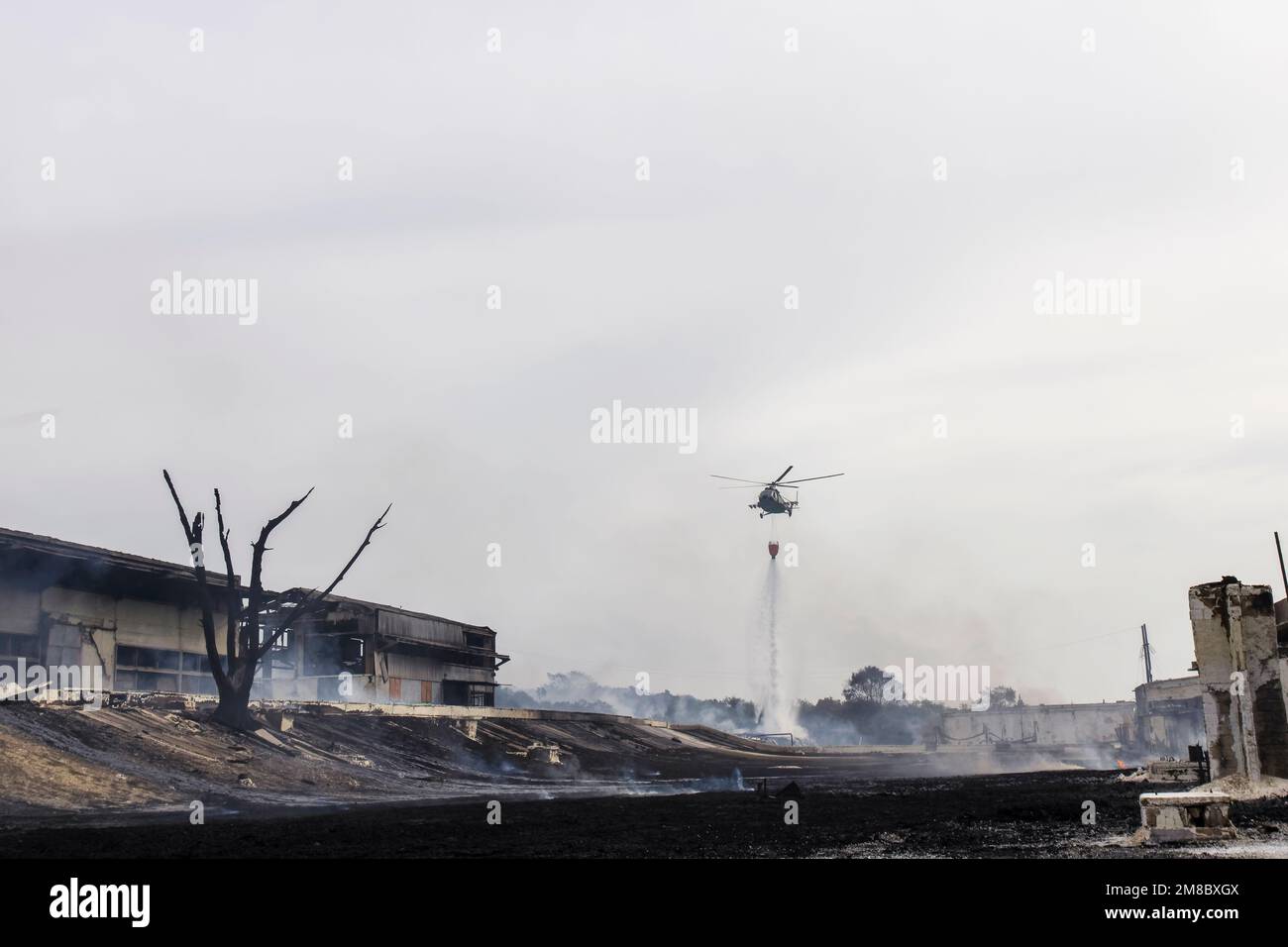Cuban armed forces helicopter putting out the fire from the explosion ...
