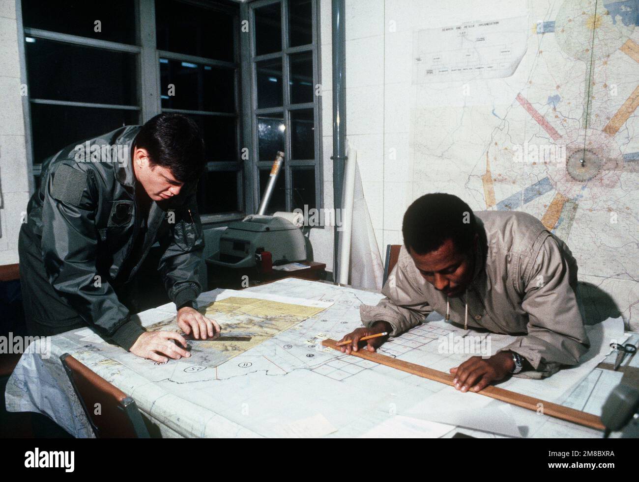 CPT Karl West, 55th Special Operations Squadron, maps out the day's ...