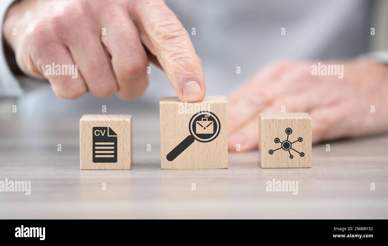 Wooden blocks with symbol of job search concept Stock Photo - Alamy