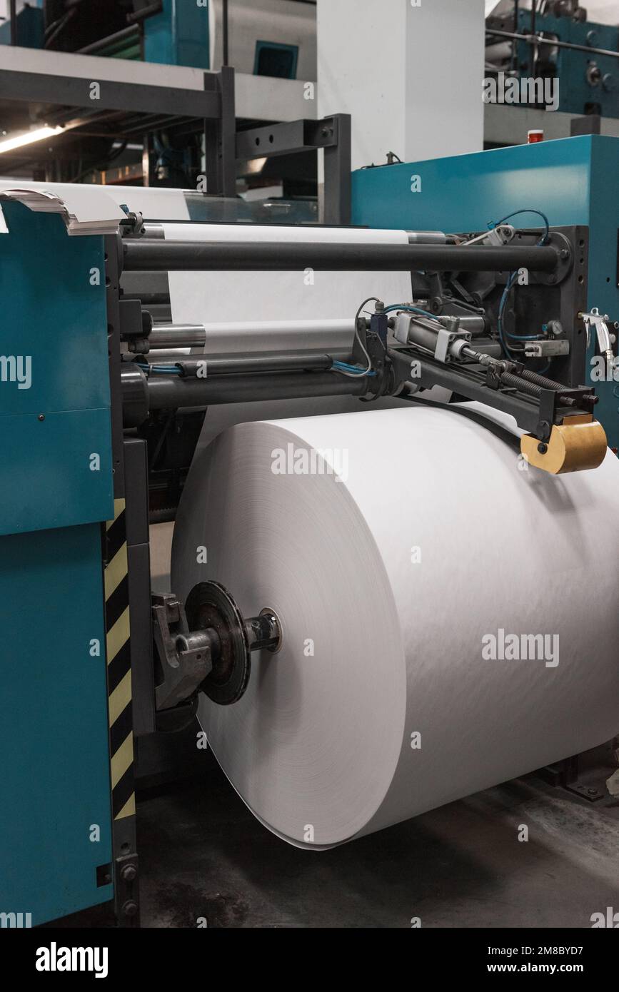 Printing house warehouse interior with printing machine Stock Photo - Alamy