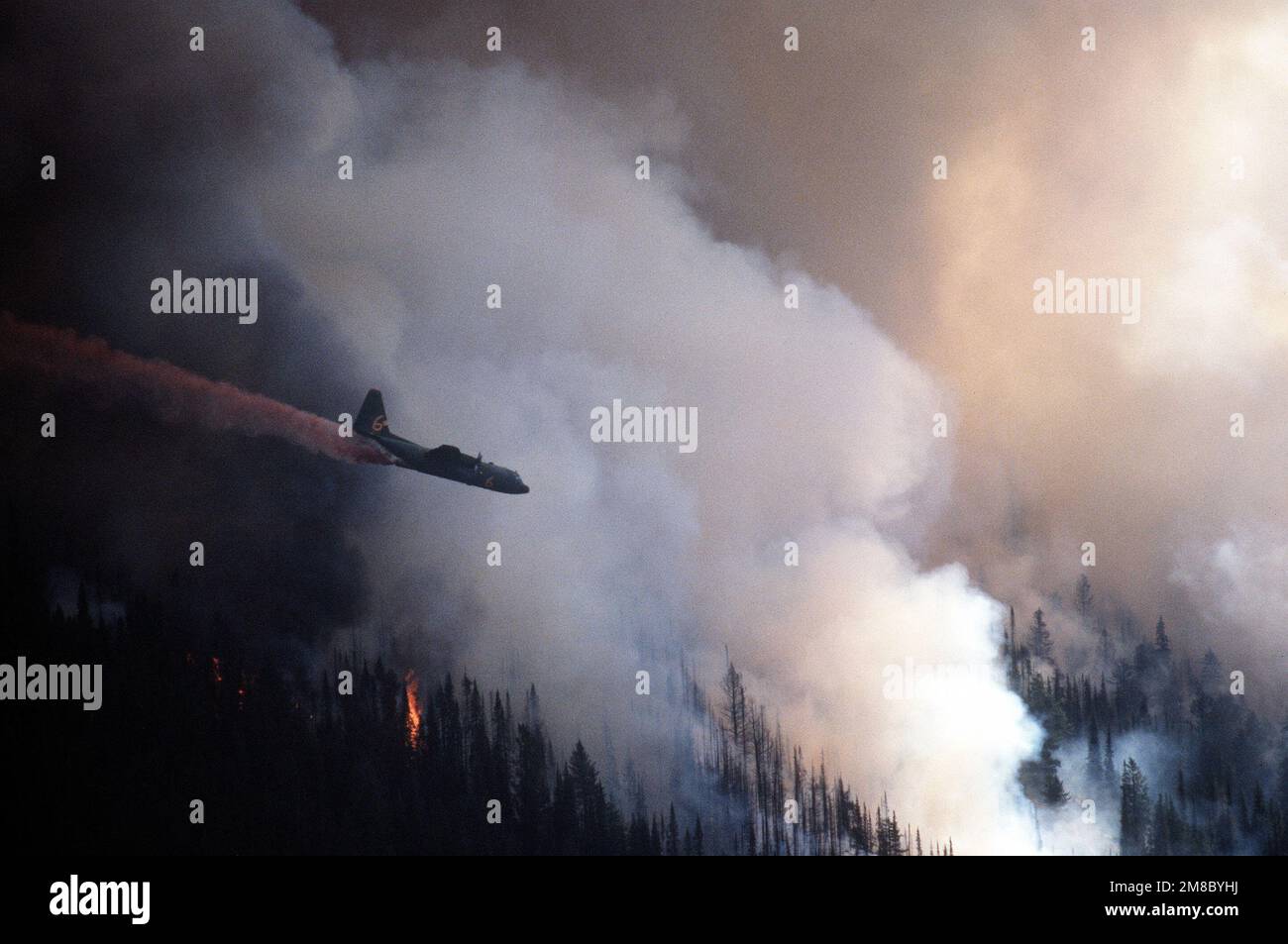 A C-130 Hercules aircraft equipped with a modular airborne firefighting ...