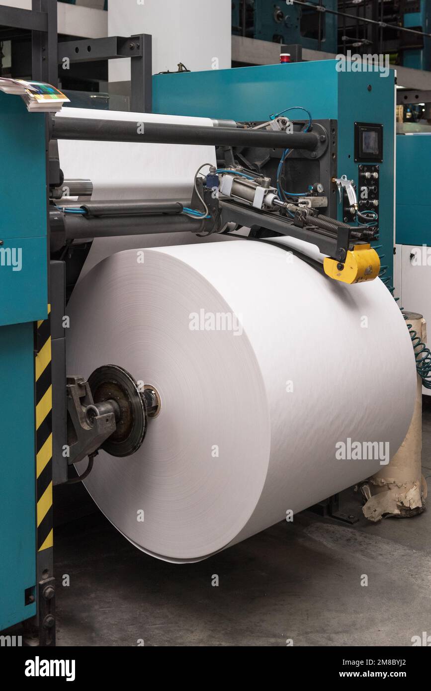 Printing house warehouse interior with printing machine Stock Photo - Alamy