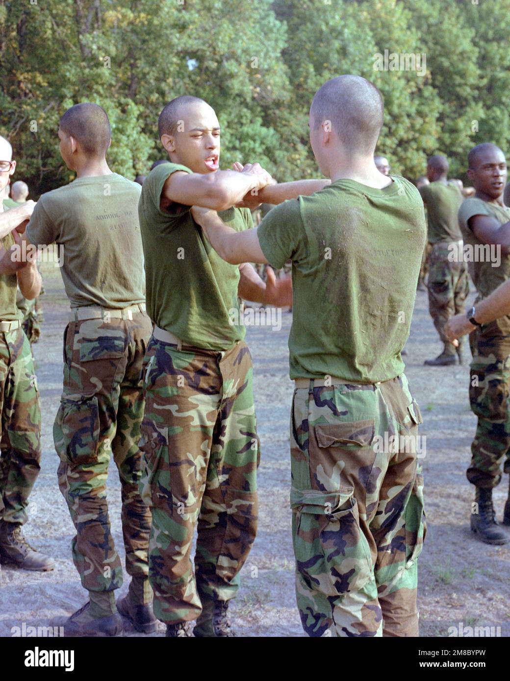 Second Battalion recruits practice hand-to-hand combat techniques. Base ...