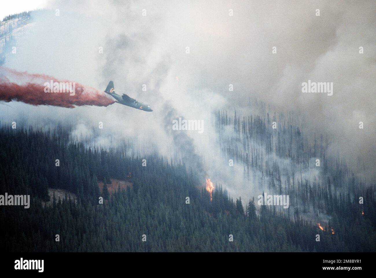 A C-130 Hercules aircraft equipped with a modular airborne firefighting ...