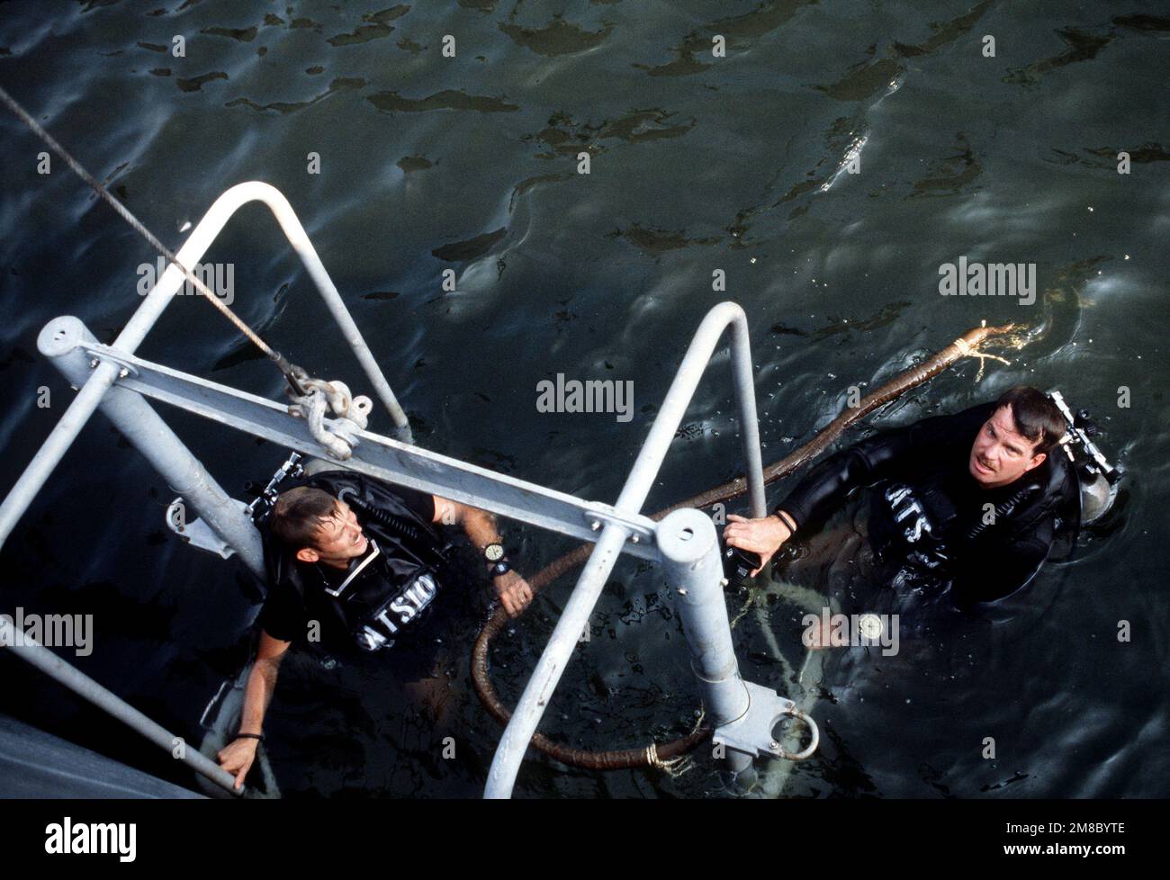 Hull Maintenance Technician 1ST Class/Diver Burt Rose, left, and ...