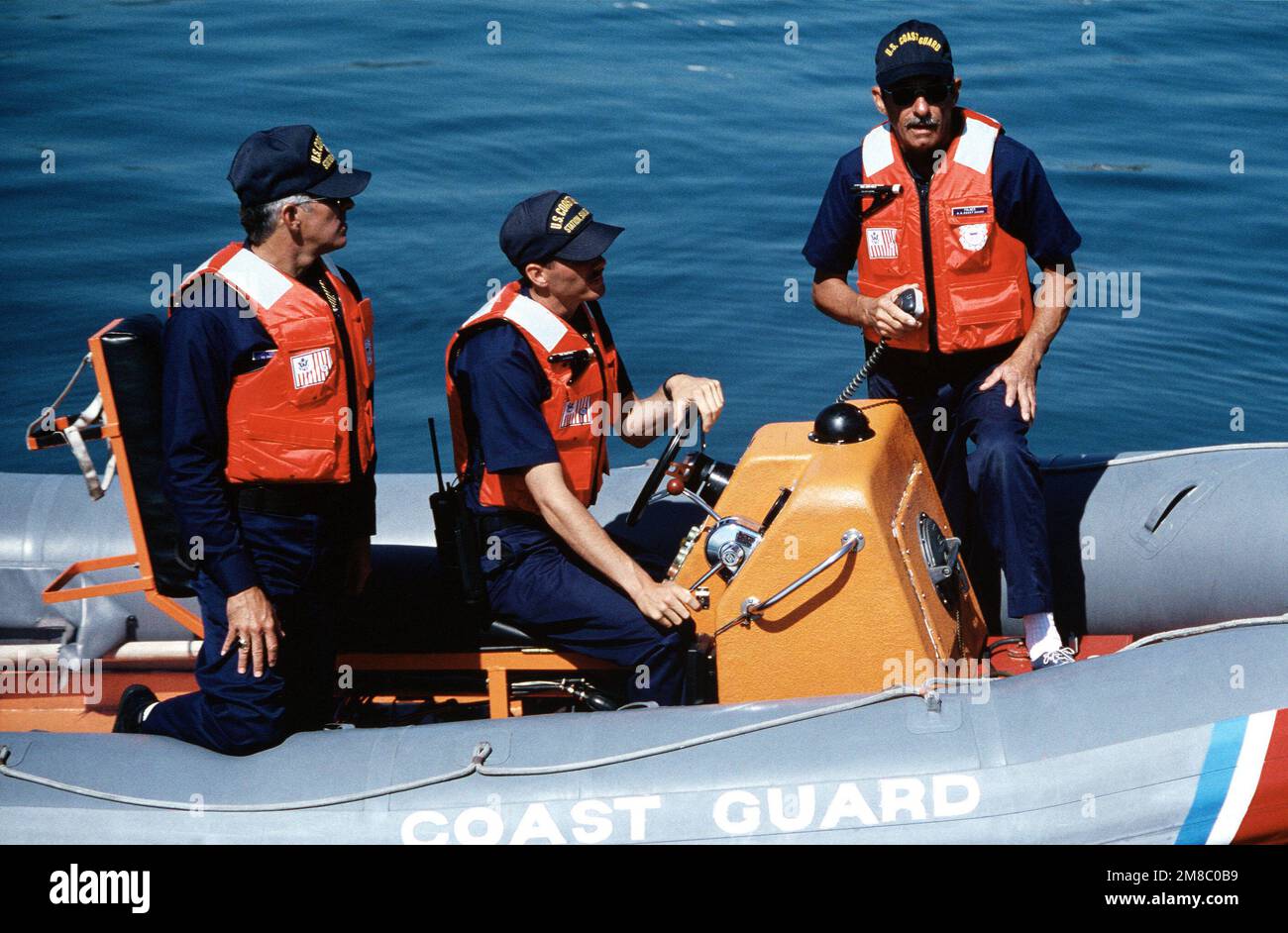 Members of the US Coast Guard plan their next move as they take part in ...