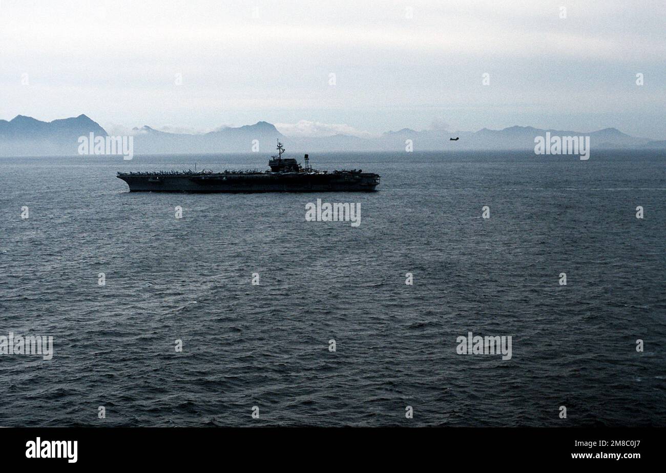 A port view of the aircraft carrier USS Constellation (CV-64) with a CH ...
