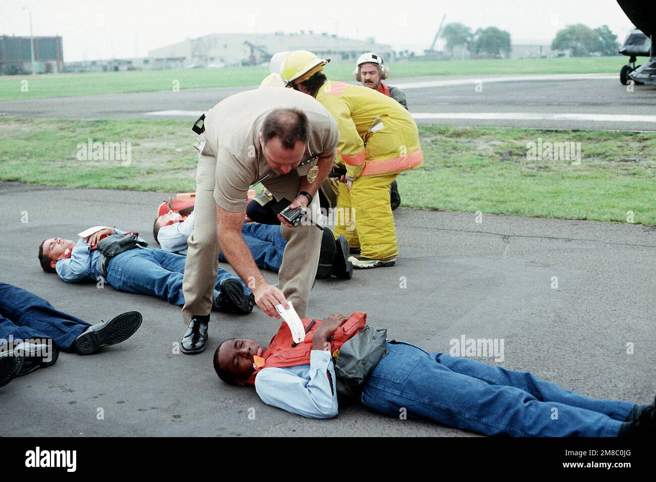 A master-at-arms checks a patients injury tag during a medical ...