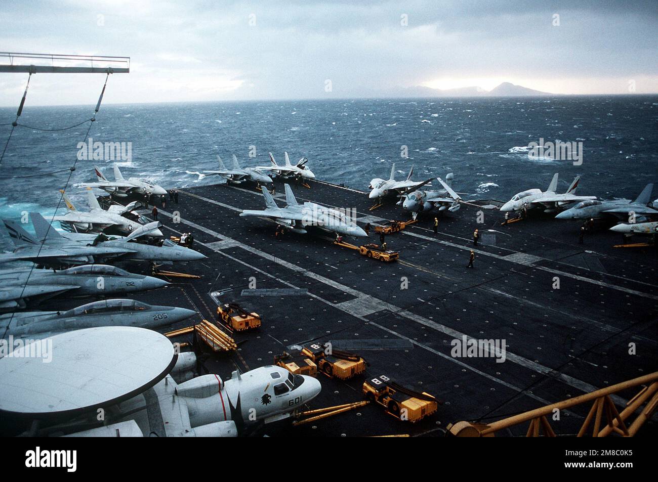 MD-3A tow tractors are used to position F-14A Tomcat aircraft and an E ...