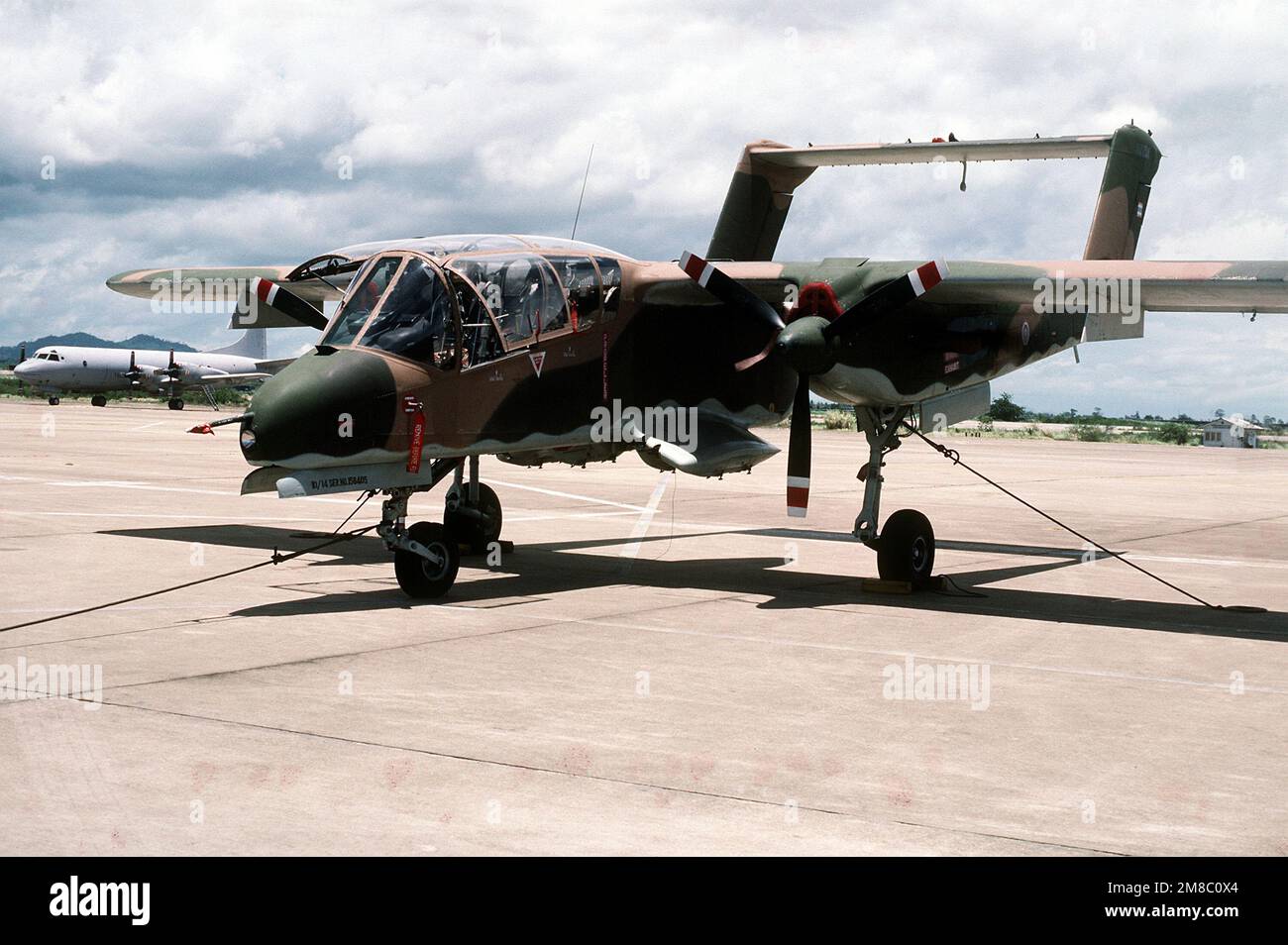 A left front view of a Thai OV-10 Bronco aircraft on the flight line ...