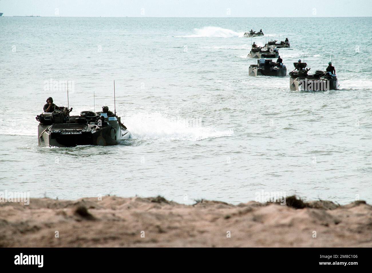 U.S. Marines come ashore in AAVP-7A1 amphibious assault vehicles during ...