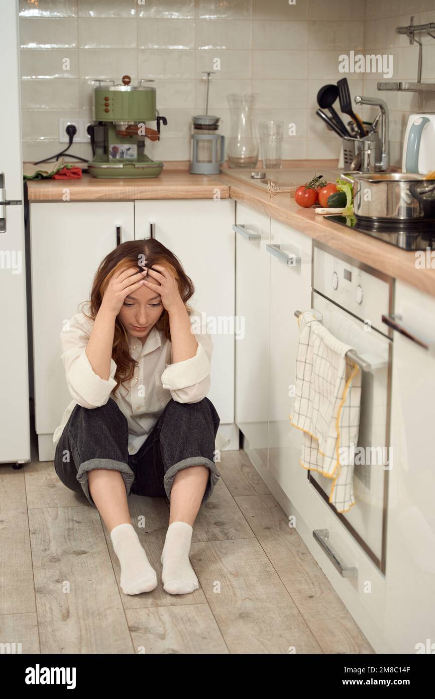 Sad lonely woman languishing in her apartment Stock Photo - Alamy