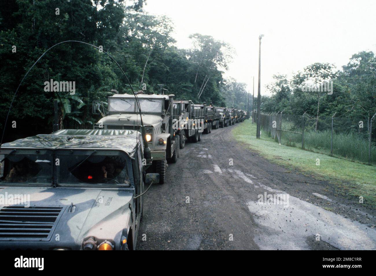 An M998 high-mobility multipurpose wheeled vehicle (HMMWV) leads a ...