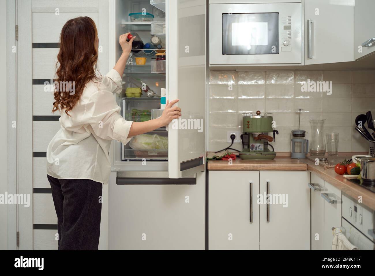 Taking food out fridge hi-res stock photography and images - Alamy