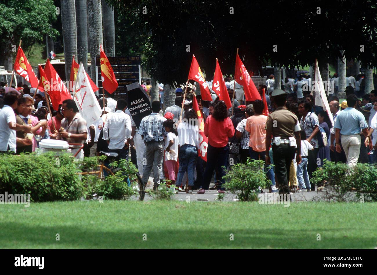 Panamanian civilians demonstrate outside the gate of Fort Amador ...