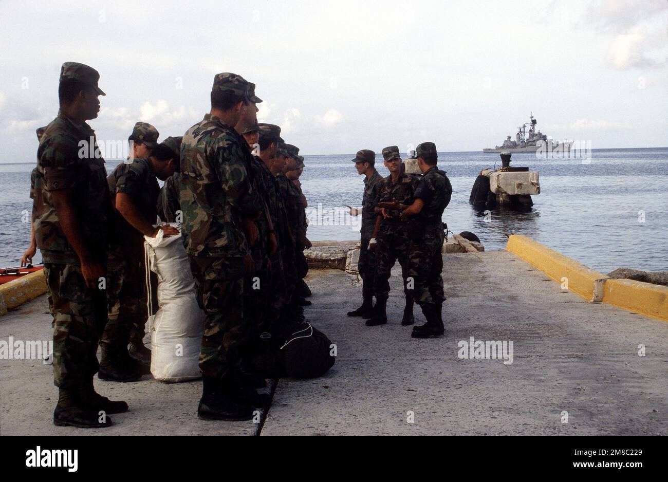 Soldiers from the 250th Military Police Company wait for transportation ...