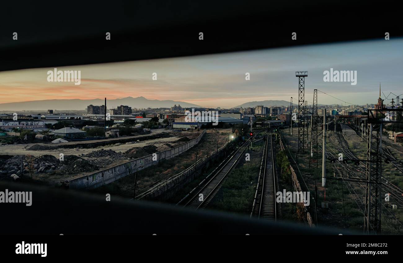 The railway with train station visible through the small window Stock ...