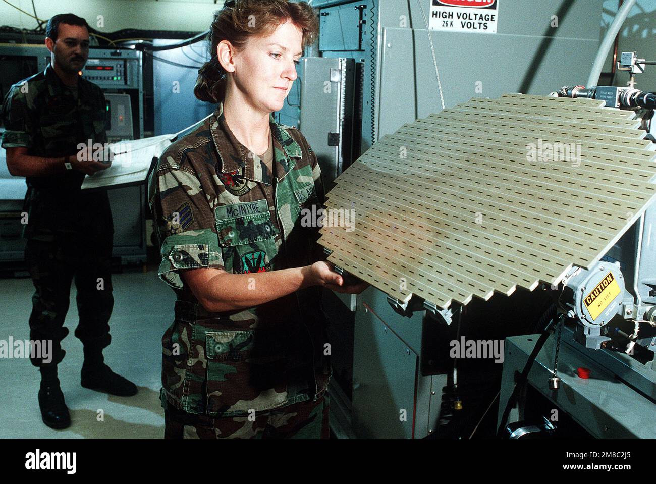 STAFF SGT. Anne E. McIntyre and STAFF SGT. Roberto Cotto check the ...